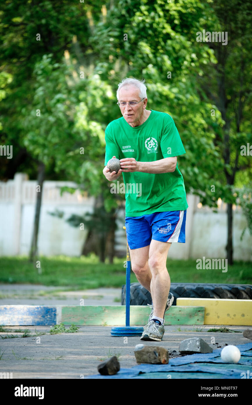 Russian athlete Mikhail Popov throws a metal ball for bocce volo Stock ...