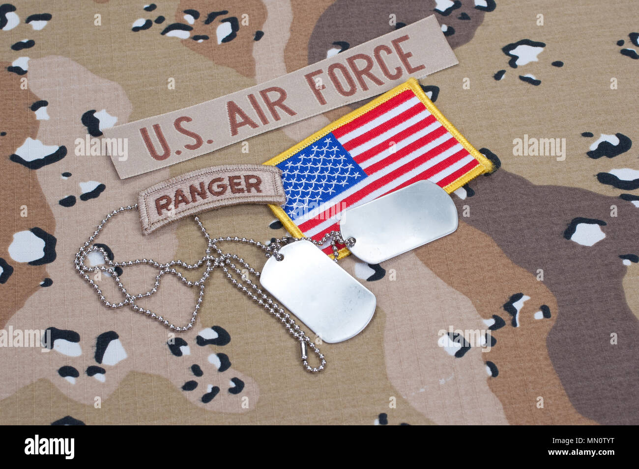 US ARMY ranger tab with blank dog tags on camouflage uniform Stock ...
