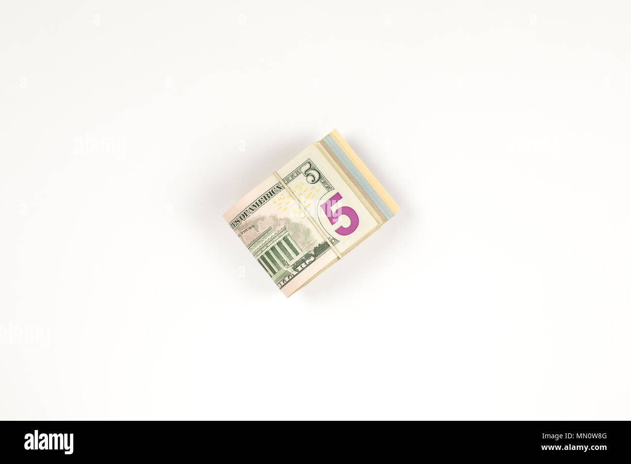 Stack of USA 5 dollars isolated on white background Stock Photo - Alamy