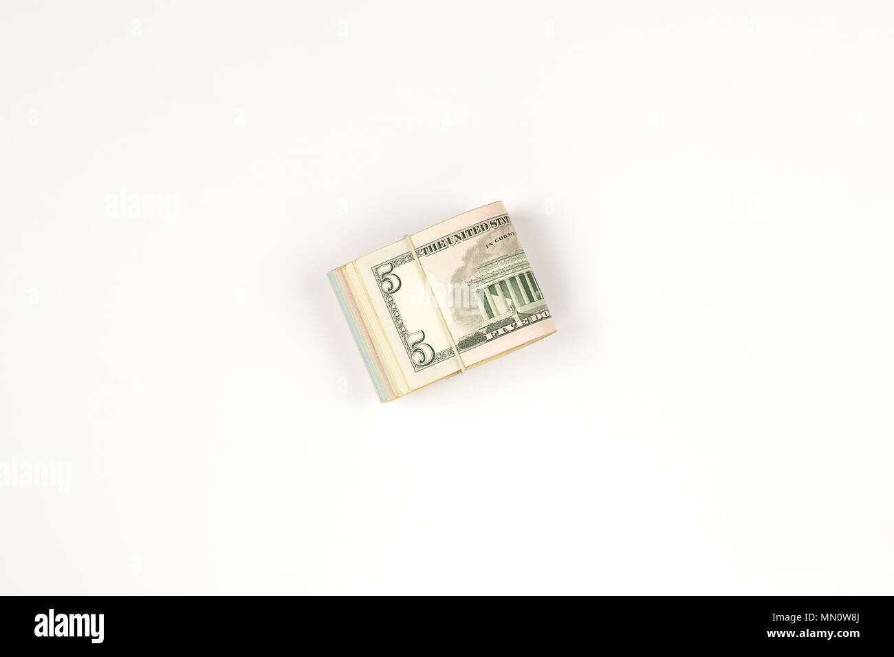 Stack of USA 5 dollars isolated on white background Stock Photo - Alamy