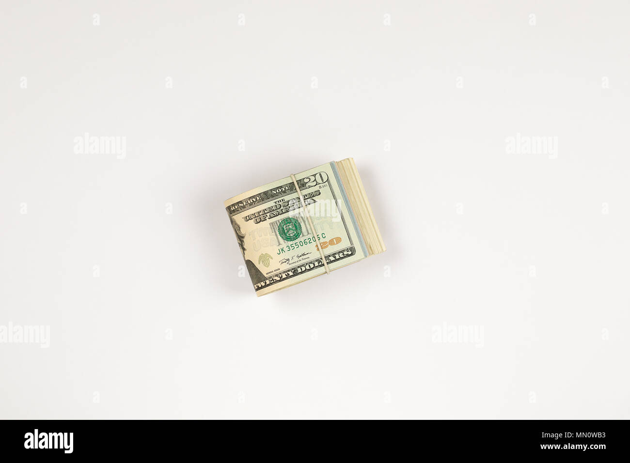 Stack of USA 20 dollars isolated on white background Stock Photo - Alamy