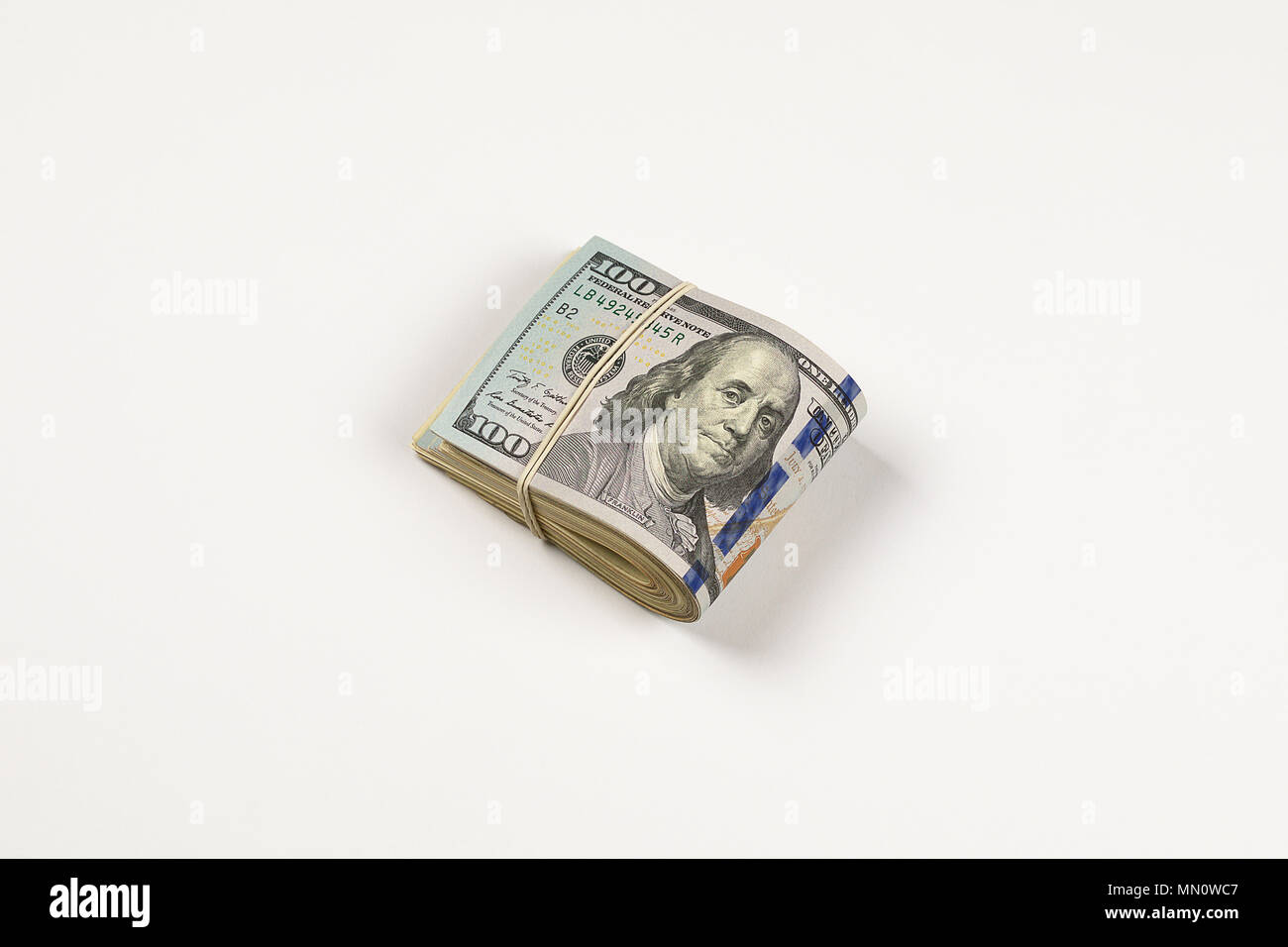 Stack of USA 100 dollars isolated on white background Stock Photo - Alamy