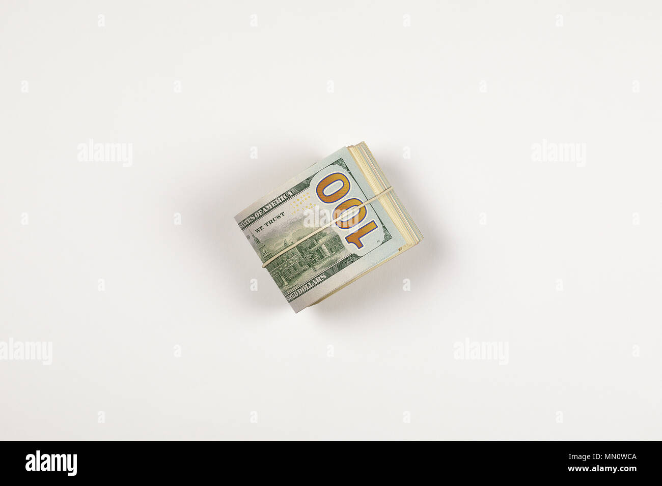 Stack of USA 100 dollars isolated on white background Stock Photo - Alamy