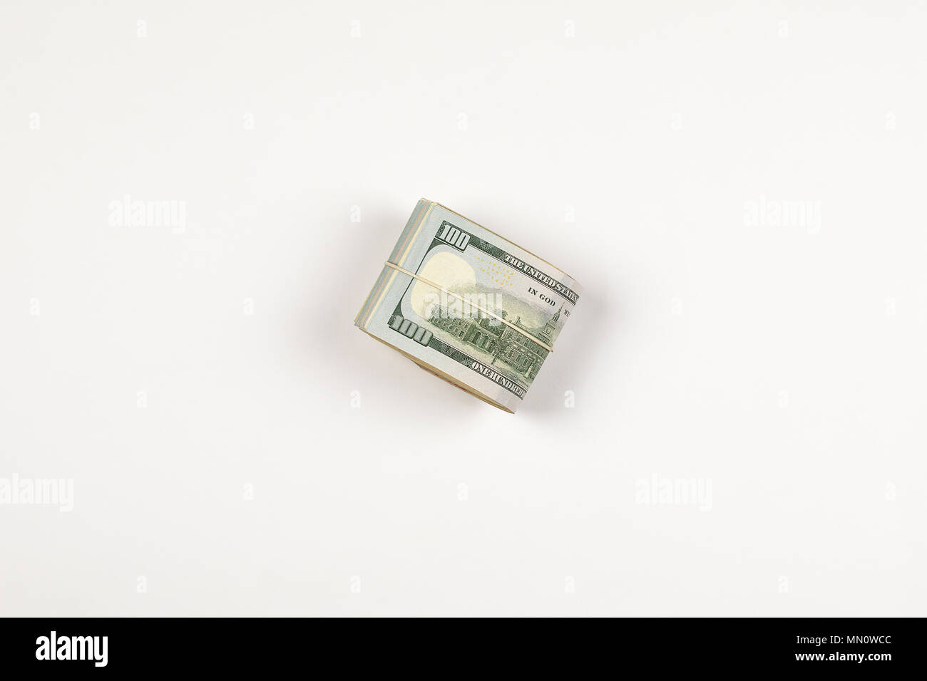 Stack of USA 100 dollars isolated on white background Stock Photo - Alamy