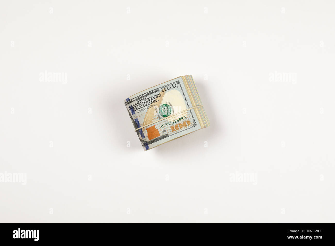 Stack of USA 100 dollars isolated on white background Stock Photo - Alamy