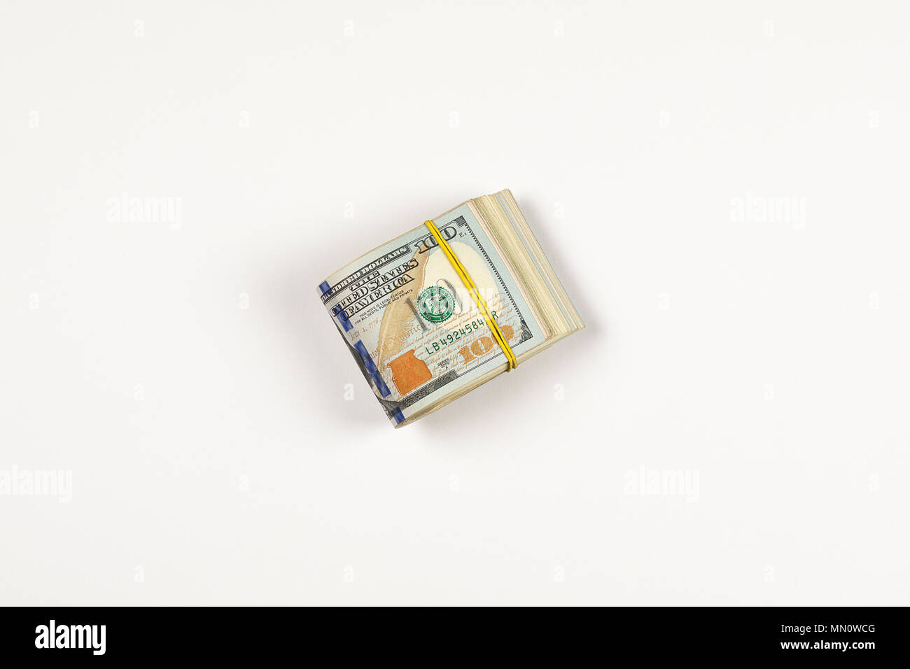 Stack of USA 100 dollars isolated on white background Stock Photo - Alamy