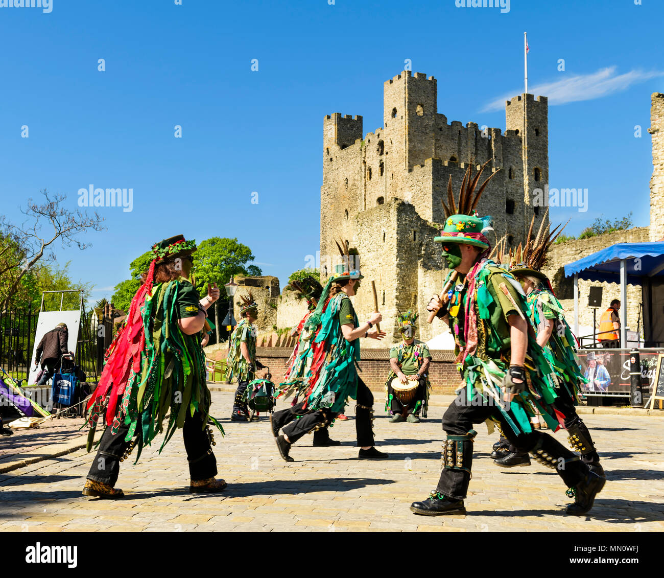 A side of border morris dancers performing in front of Rochester castle ...
