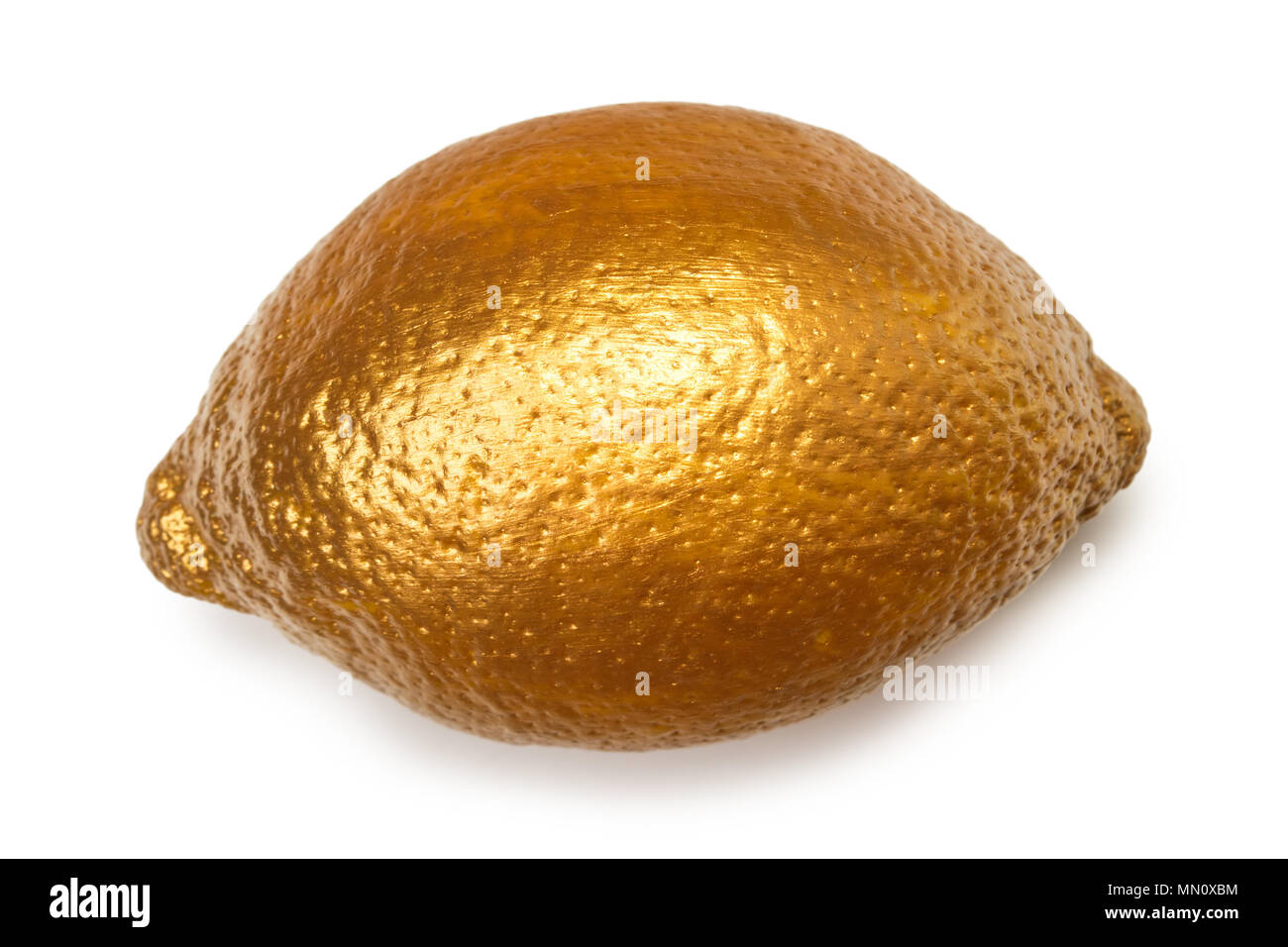 Golden lemon isolated on white background. Creative concept with fruit ...