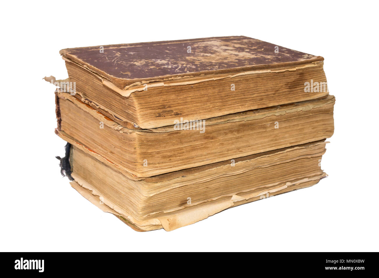 A stack of old tattered books. Vintage torn books. Antiques isolated ...