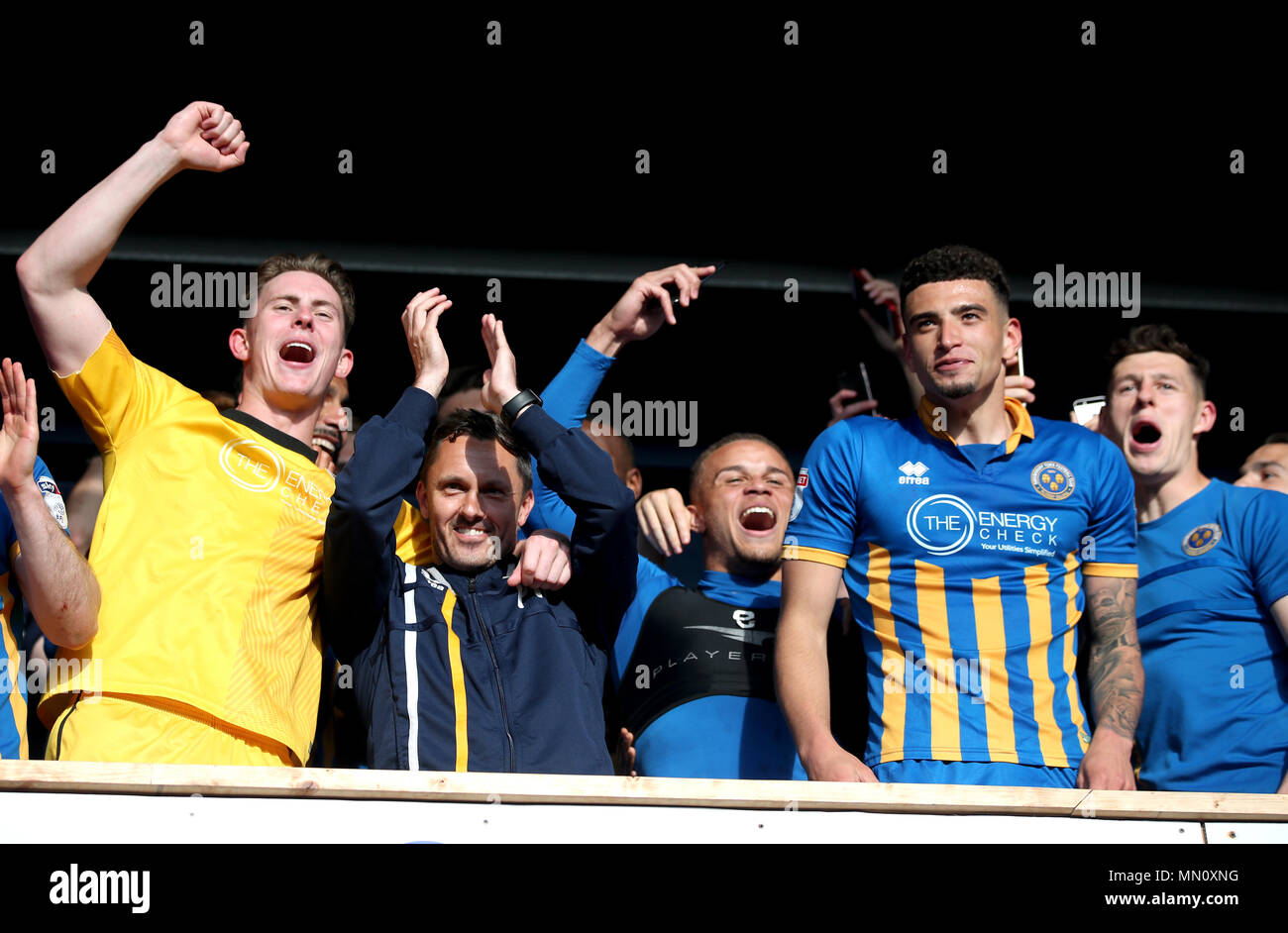 Shrewsbury Town's manager Paul Hurst (second from left) celebrates with ...
