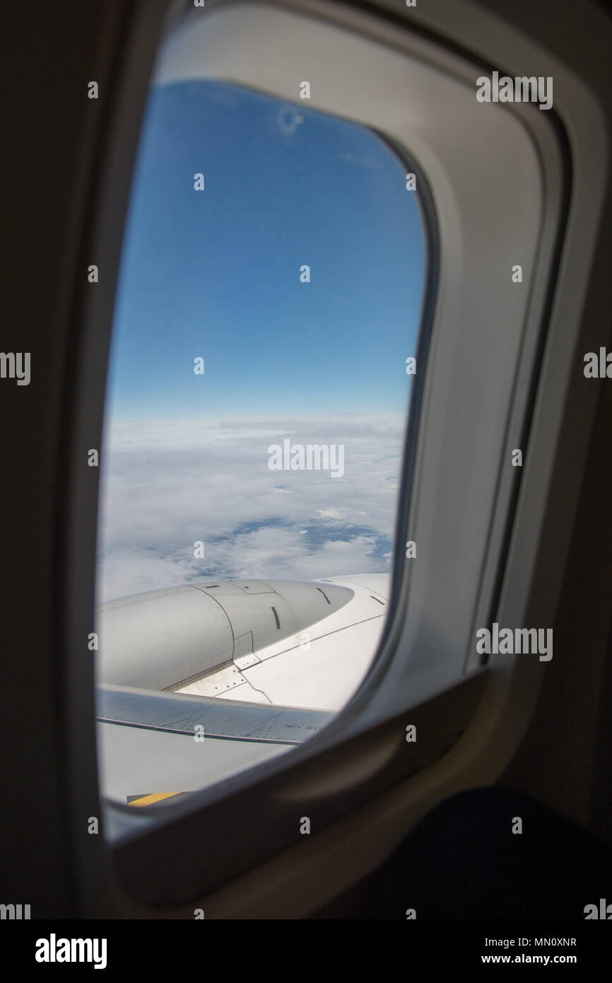 View of sky and clouds from areoplane window Stock Photo - Alamy