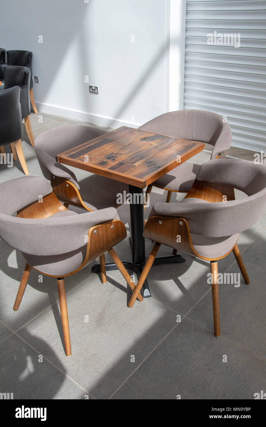 Table and chairs and in an office sitting area, office cafeteria for ...