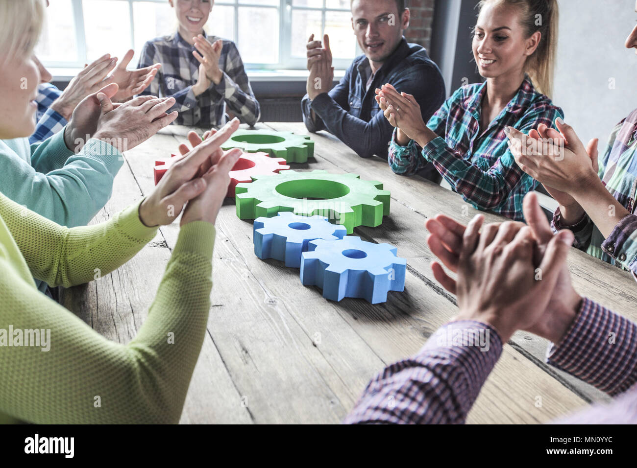 Cogs with hands hi-res stock photography and images - Alamy