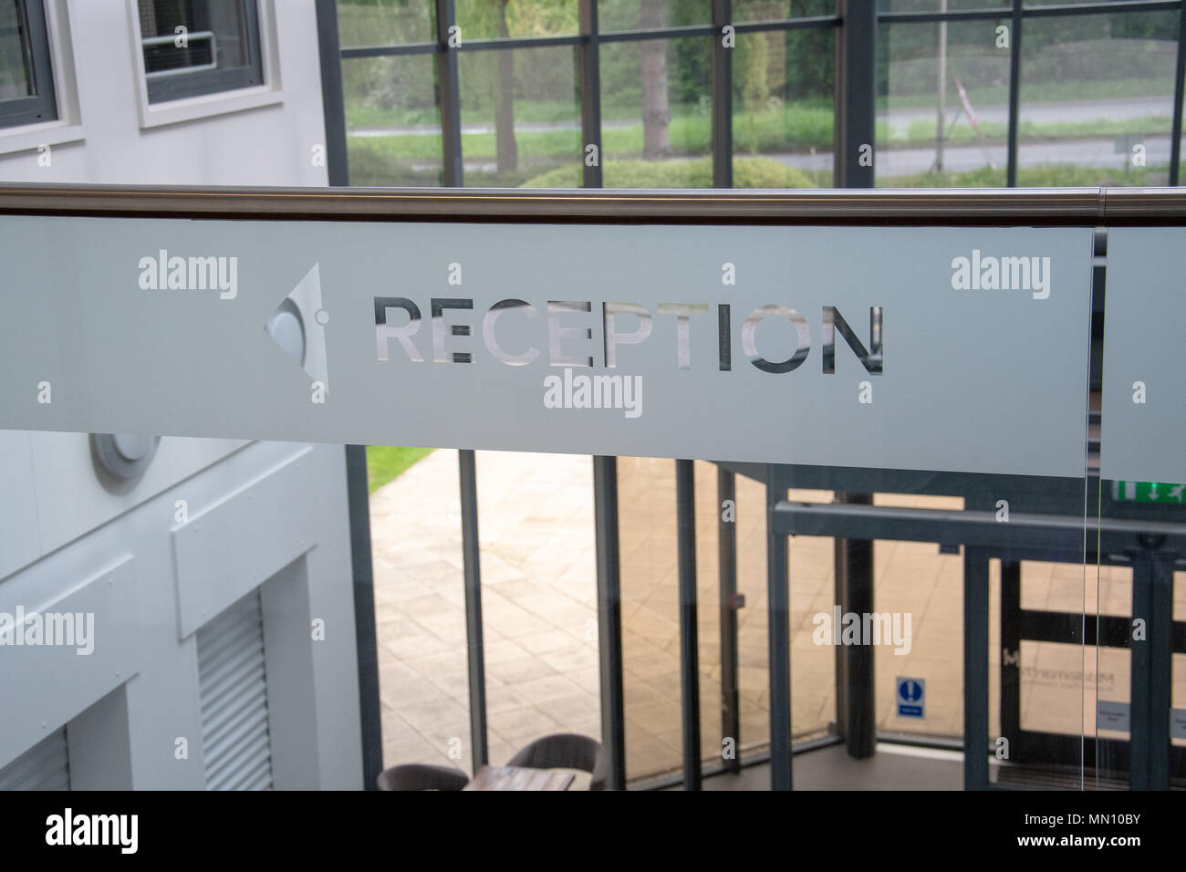 Reception sign and directions on a glass background Stock Photo - Alamy