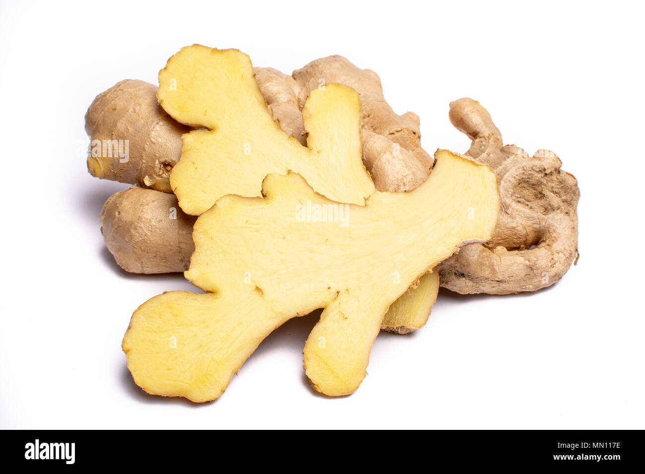 Fresh big ginger root close up copy space isolated on white background ...