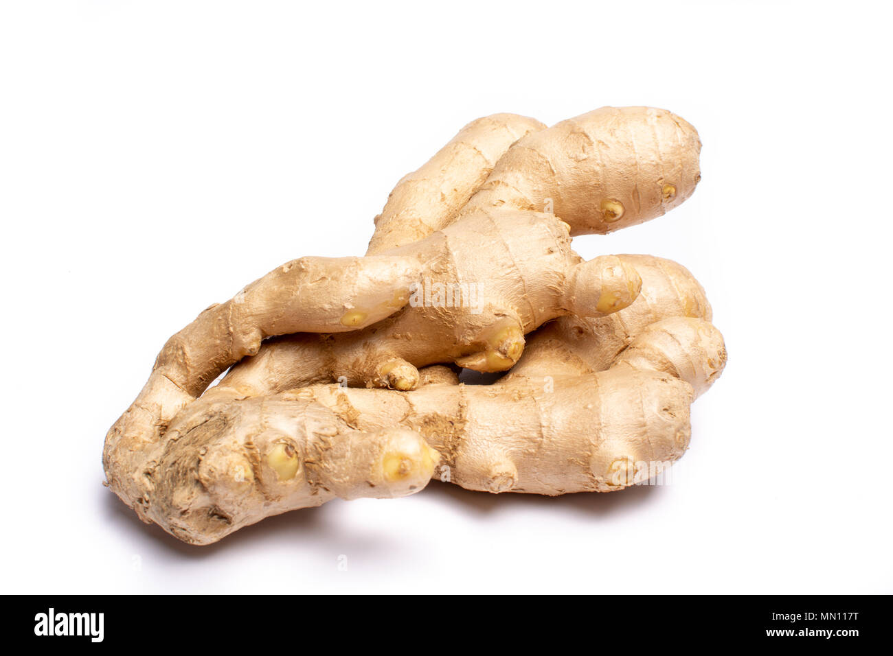 Fresh big ginger root close up copy space isolated on white background ...