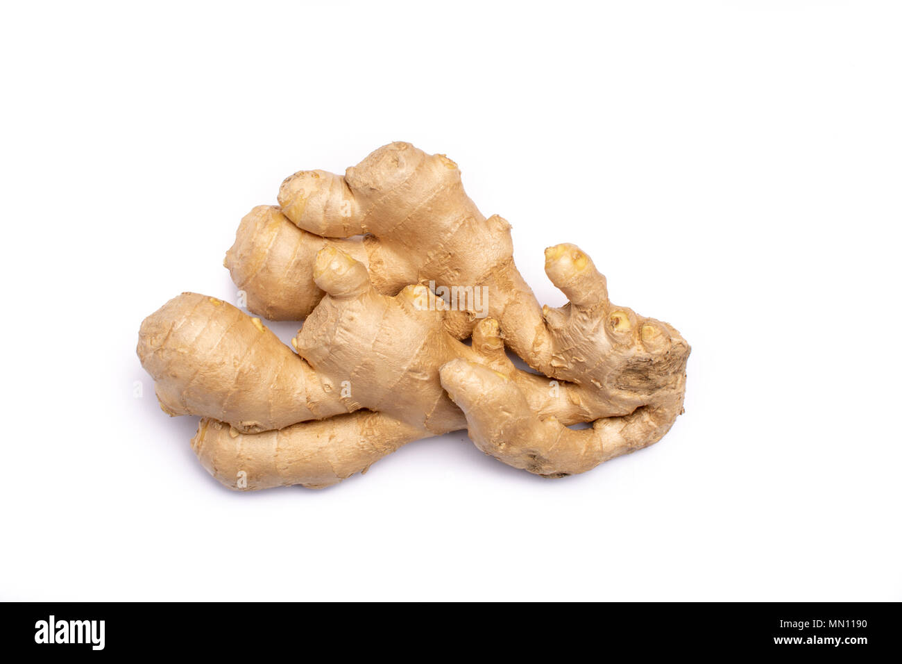 Fresh big ginger root close up copy space isolated on white background ...