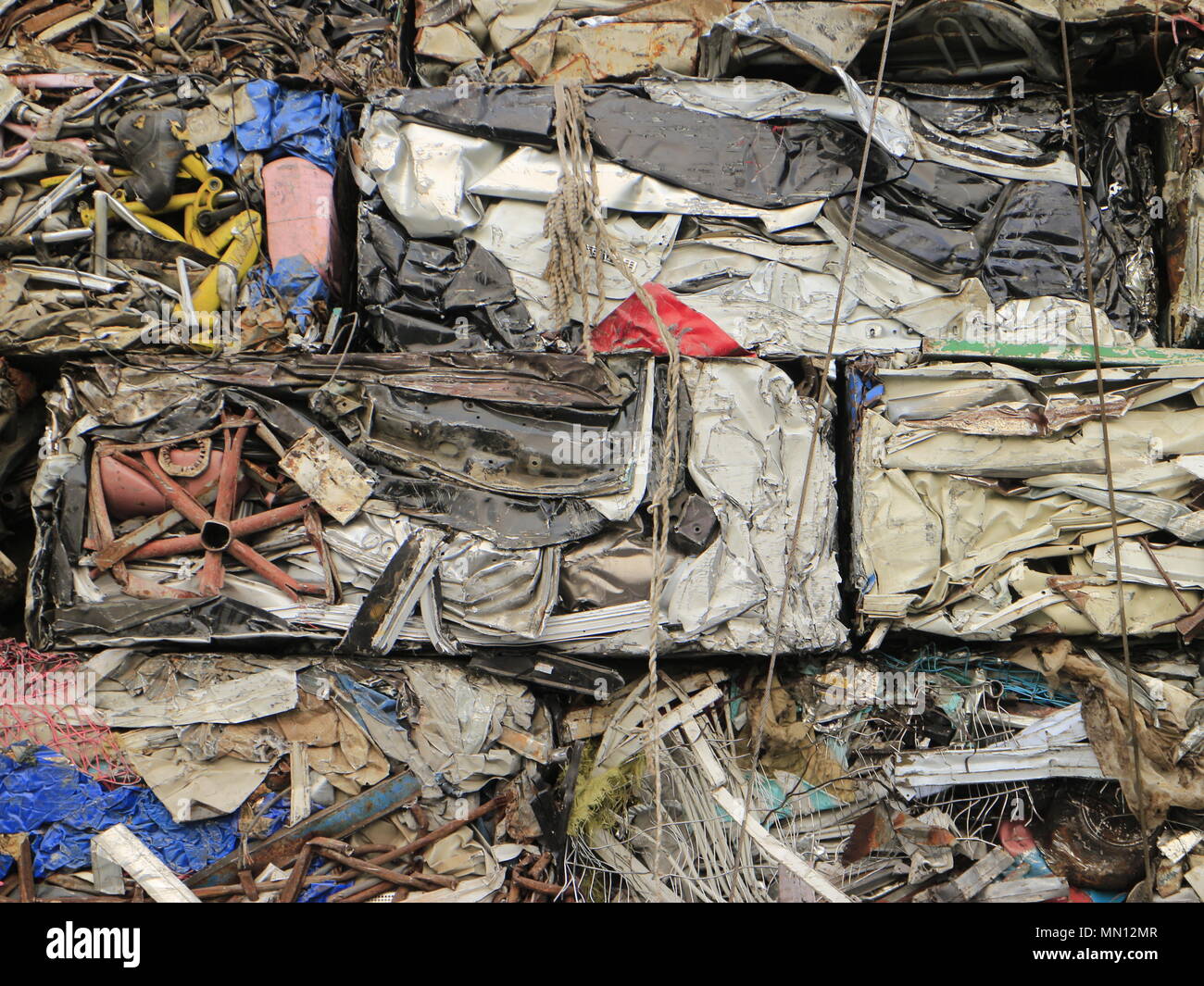Compacted scrap metal for recycling Stock Photo - Alamy