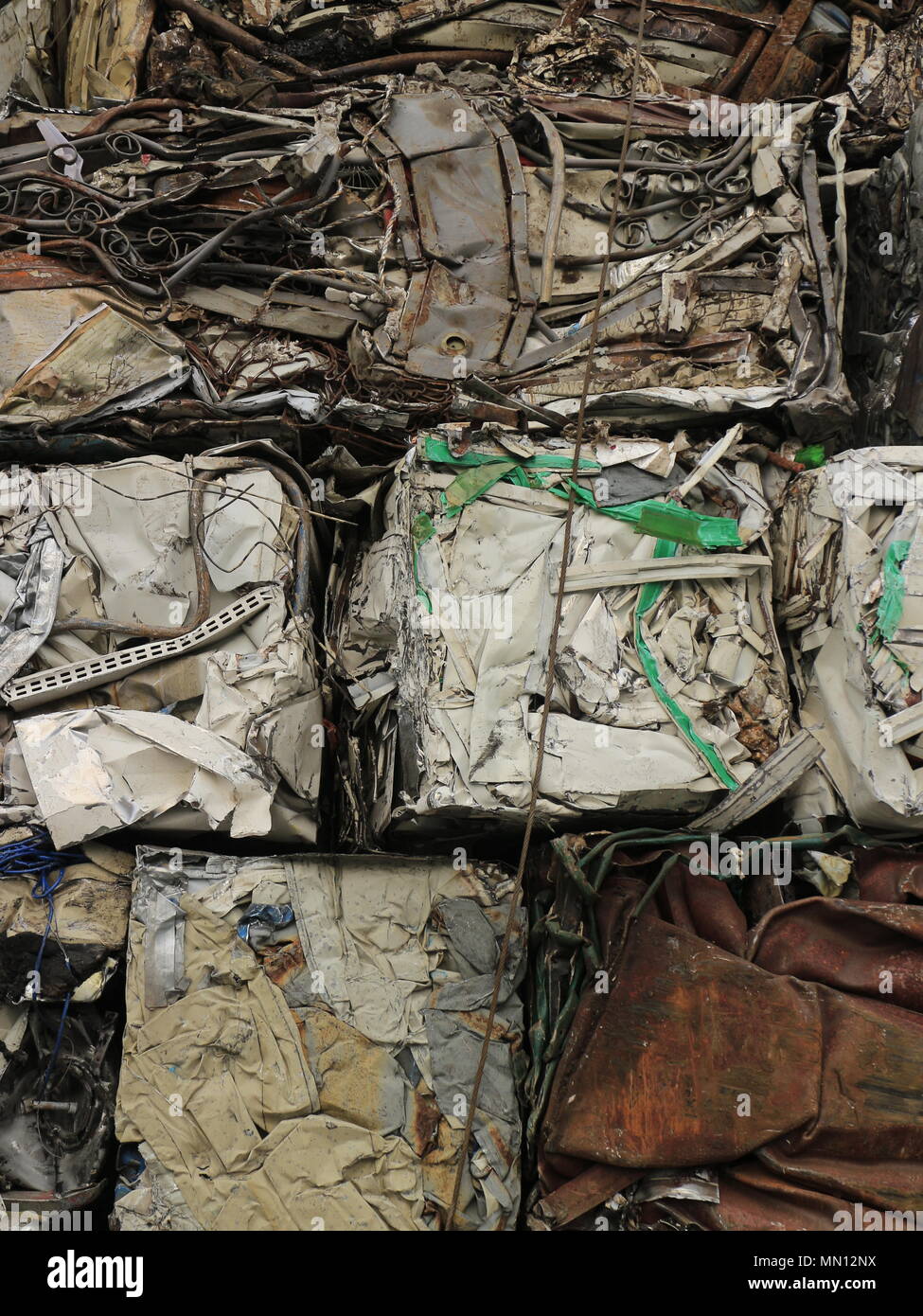 Compacted scrap metal for recycling Stock Photo - Alamy