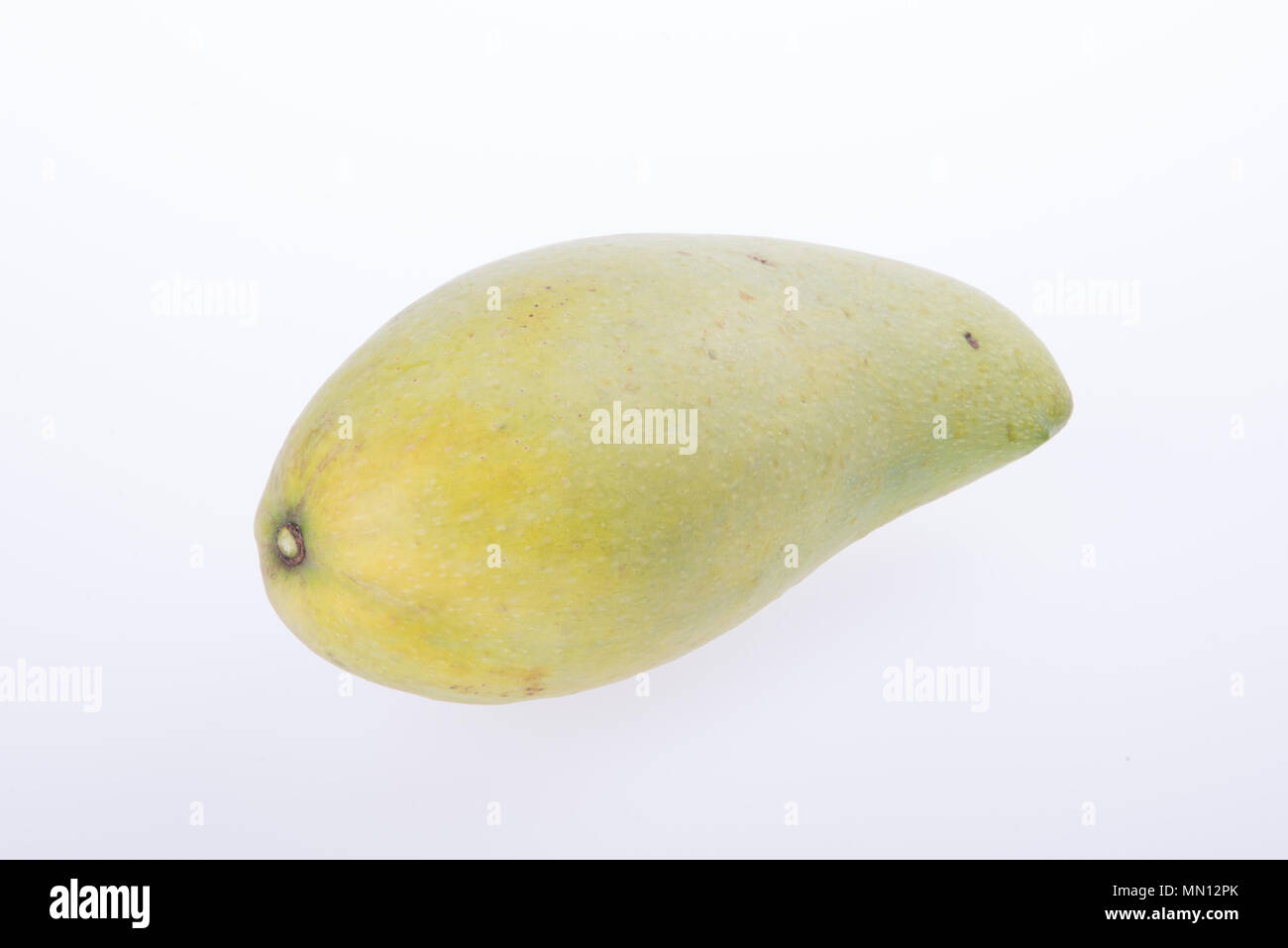 mangos or green yellow mangos on background Stock Photo - Alamy