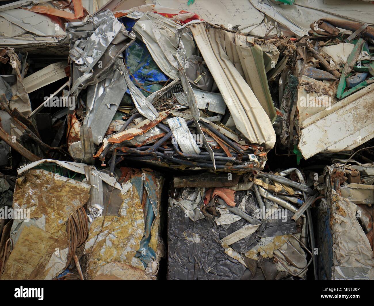 Compacted scrap metal for recycling Stock Photo - Alamy