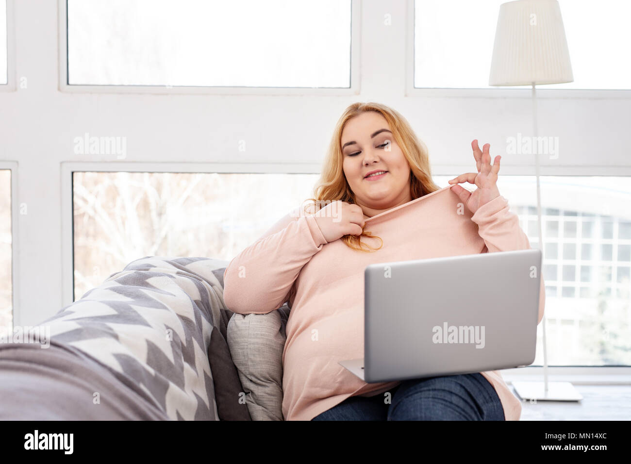 Happy fat woman communicating with friends Stock Photo - Alamy