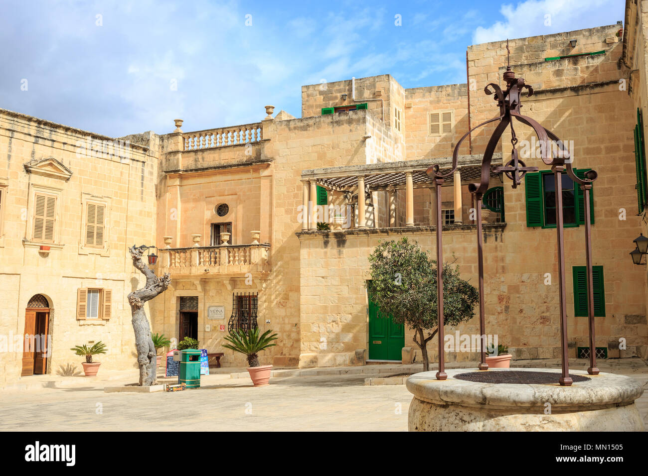 Mdina, Malta. Well at Misrah Mesquita square and traditional facade ...