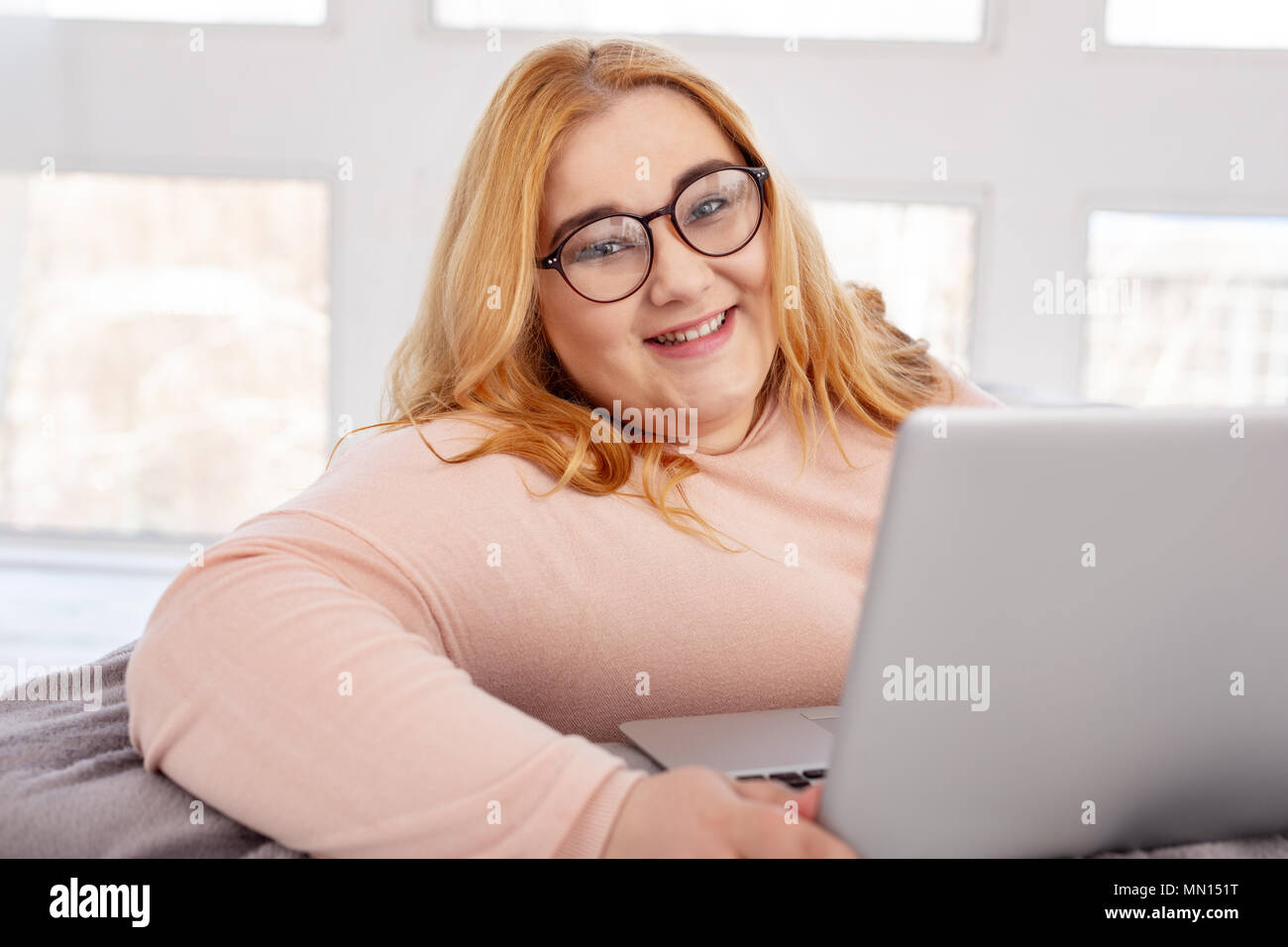Obese woman sitting home hi-res stock photography and images - Alamy