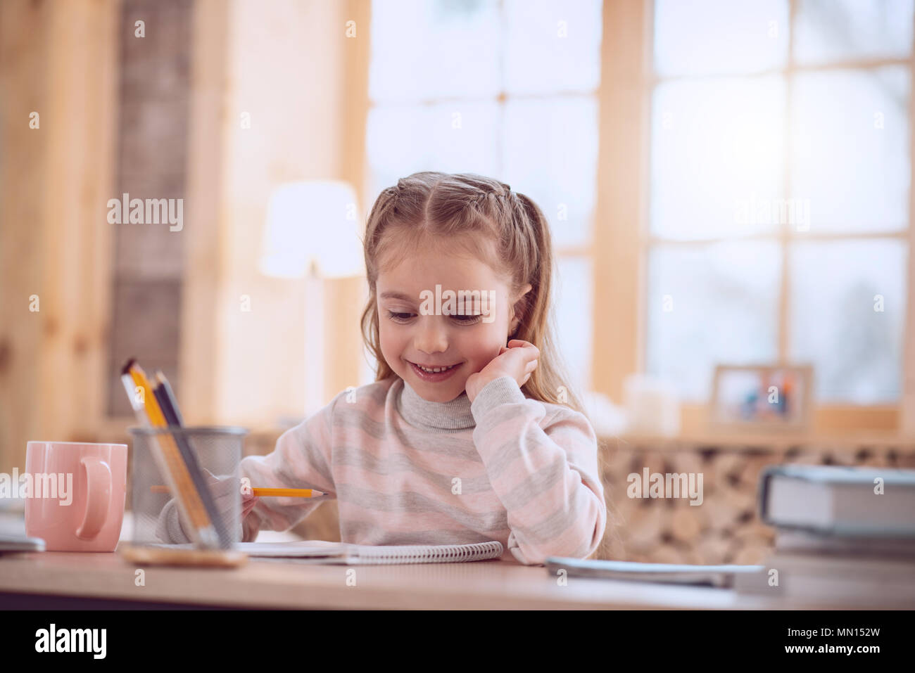 Cute smart girl studying at home Stock Photo - Alamy