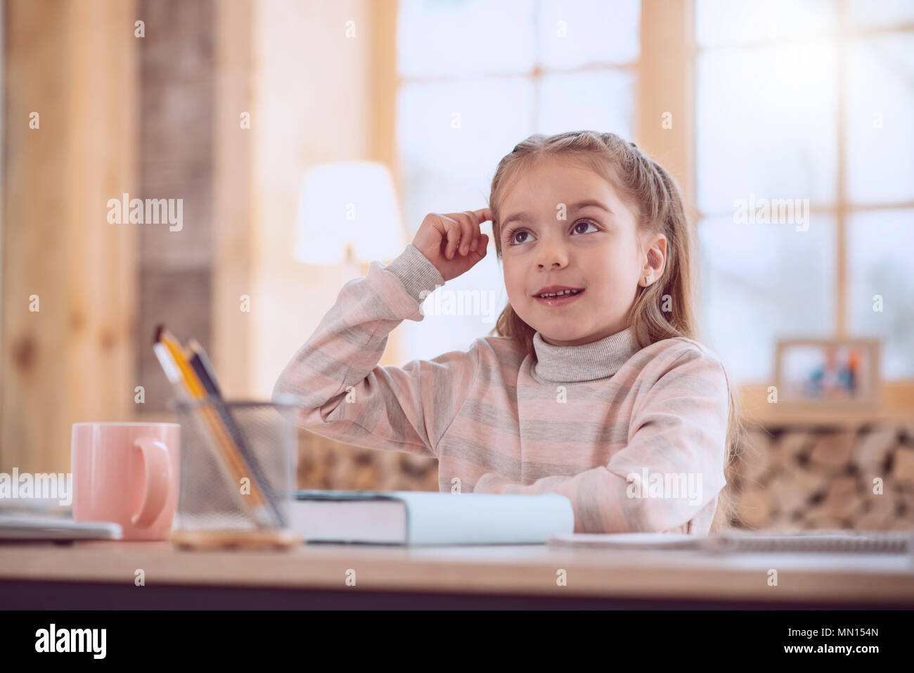 Nice young girl thinking Stock Photo - Alamy