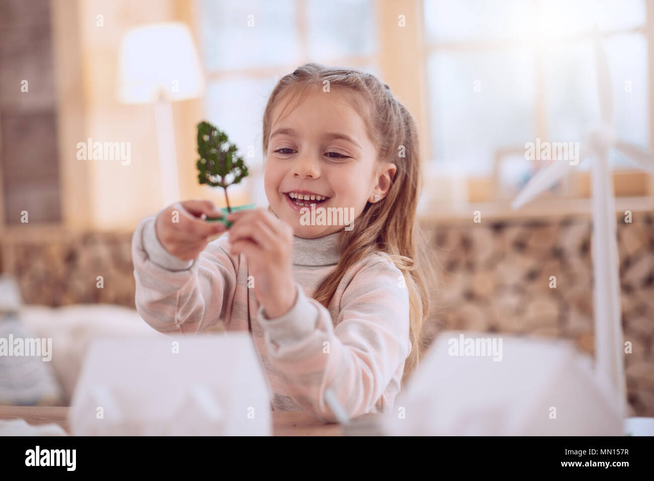 Cheerful positive girl playing Stock Photo - Alamy