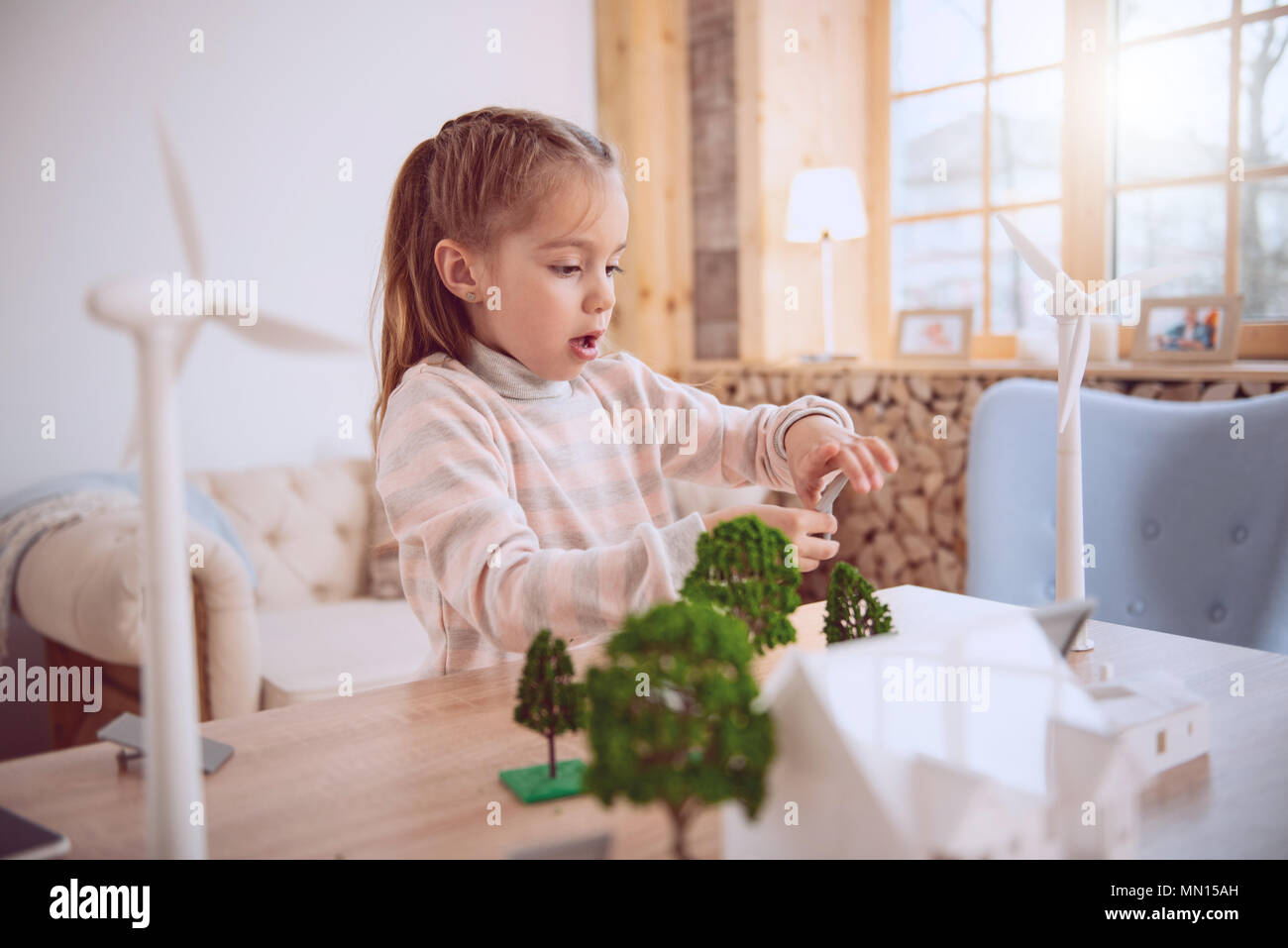 Smart nice girl standing at the table Stock Photo - Alamy
