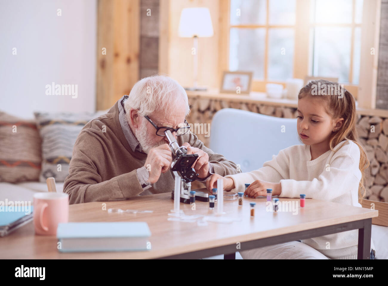 Serious elderly man working Stock Photo - Alamy