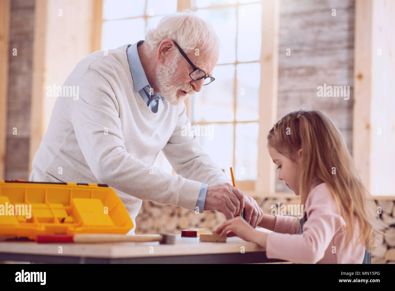 Smart nice man doing a drawing Stock Photo - Alamy
