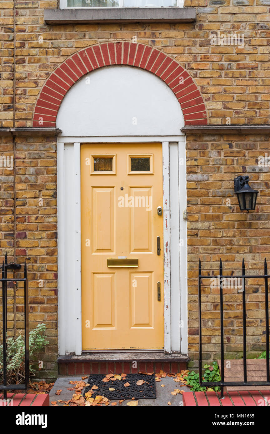 London, UK - typical english wooden yellow front door Stock Photo - Alamy