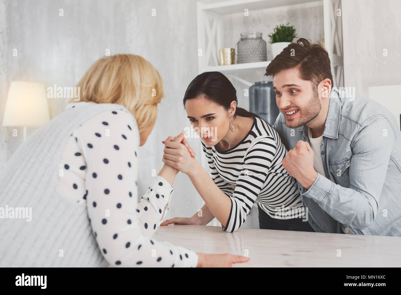 Nice cheerful man supporting his wife Stock Photo - Alamy