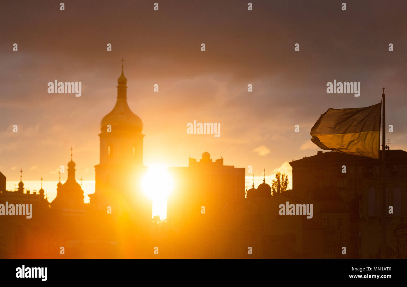 13 May 2018, Ukraine, Kiev: The sun sets behind the houses of the ...
