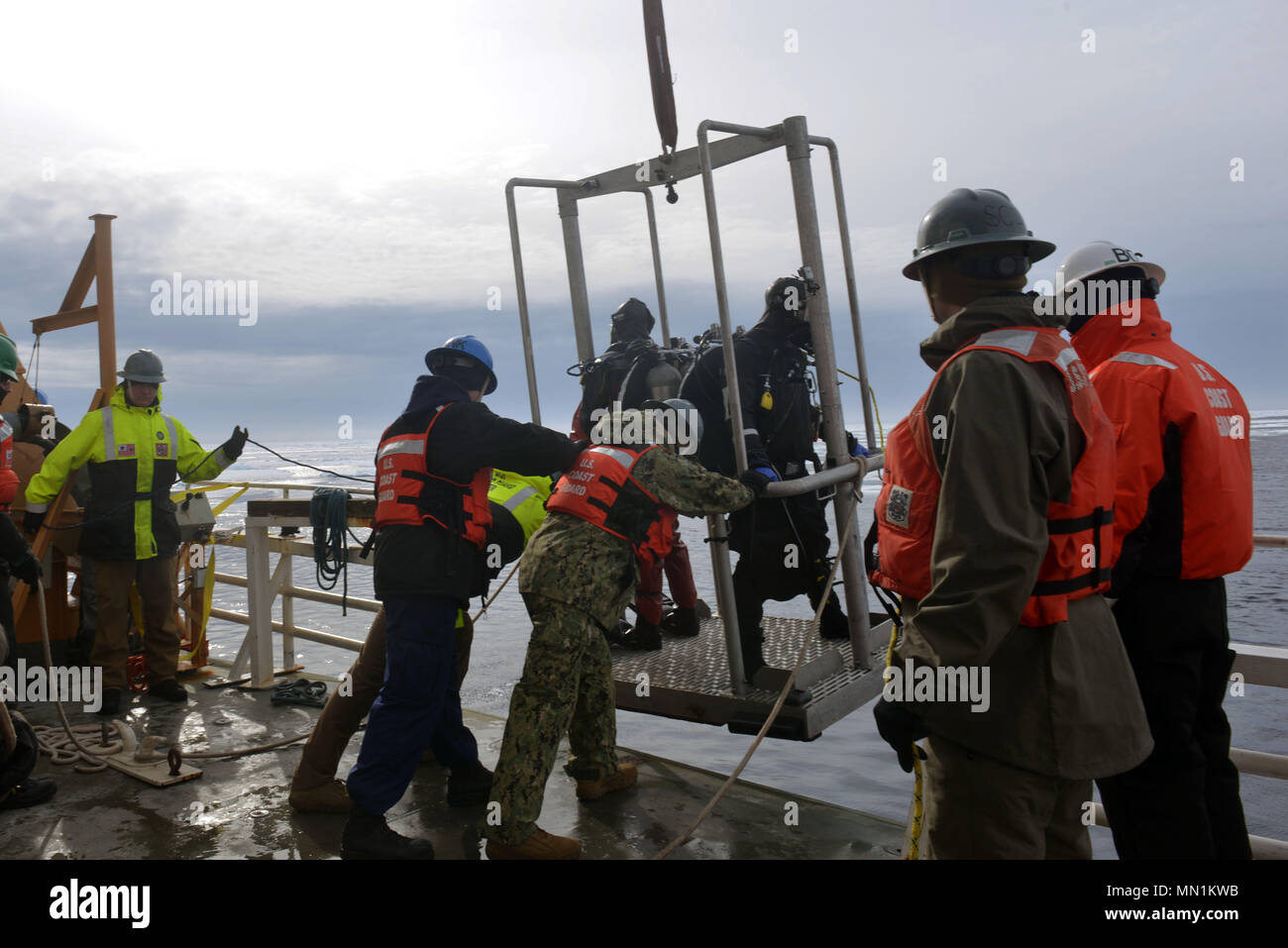 Petty Officer 1st Class David Bradbury (left on dive stage) and Petty ...