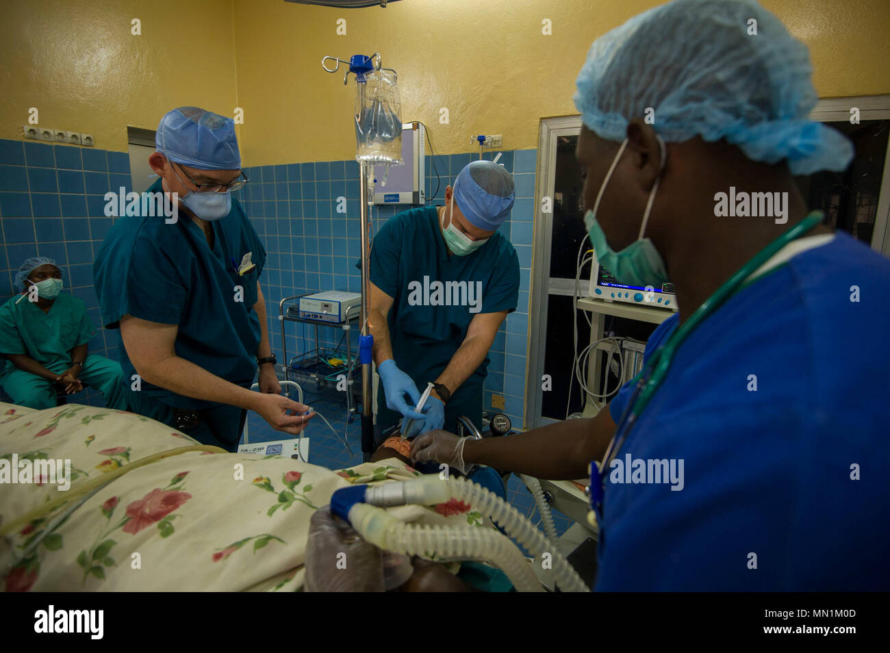 U.S. Army Maj. Michael Nickerson, an anesthesiologist, Capt. Matthew ...