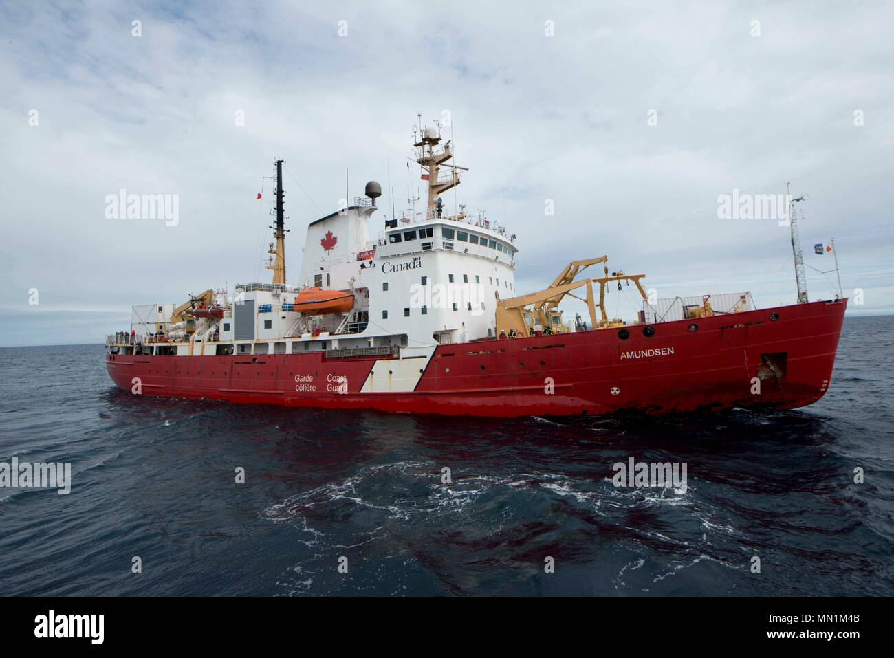 The crew of Canadian Coast Guard Ship Amundsen prepares to tie up ...