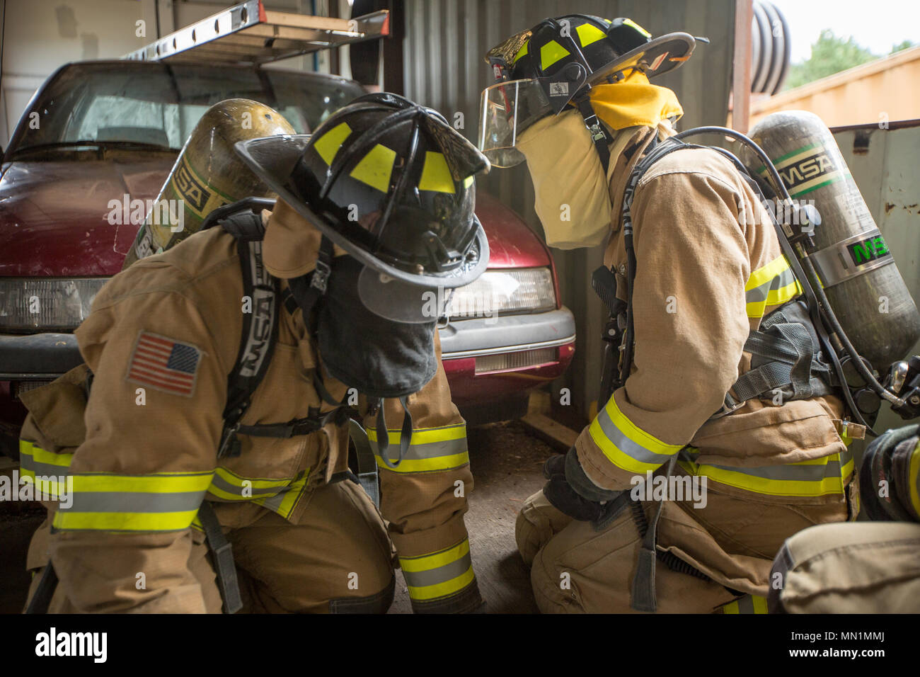 U.S. Army Pfc. Kevin Schmitz, 336th Firefighter Detachment (left), and ...