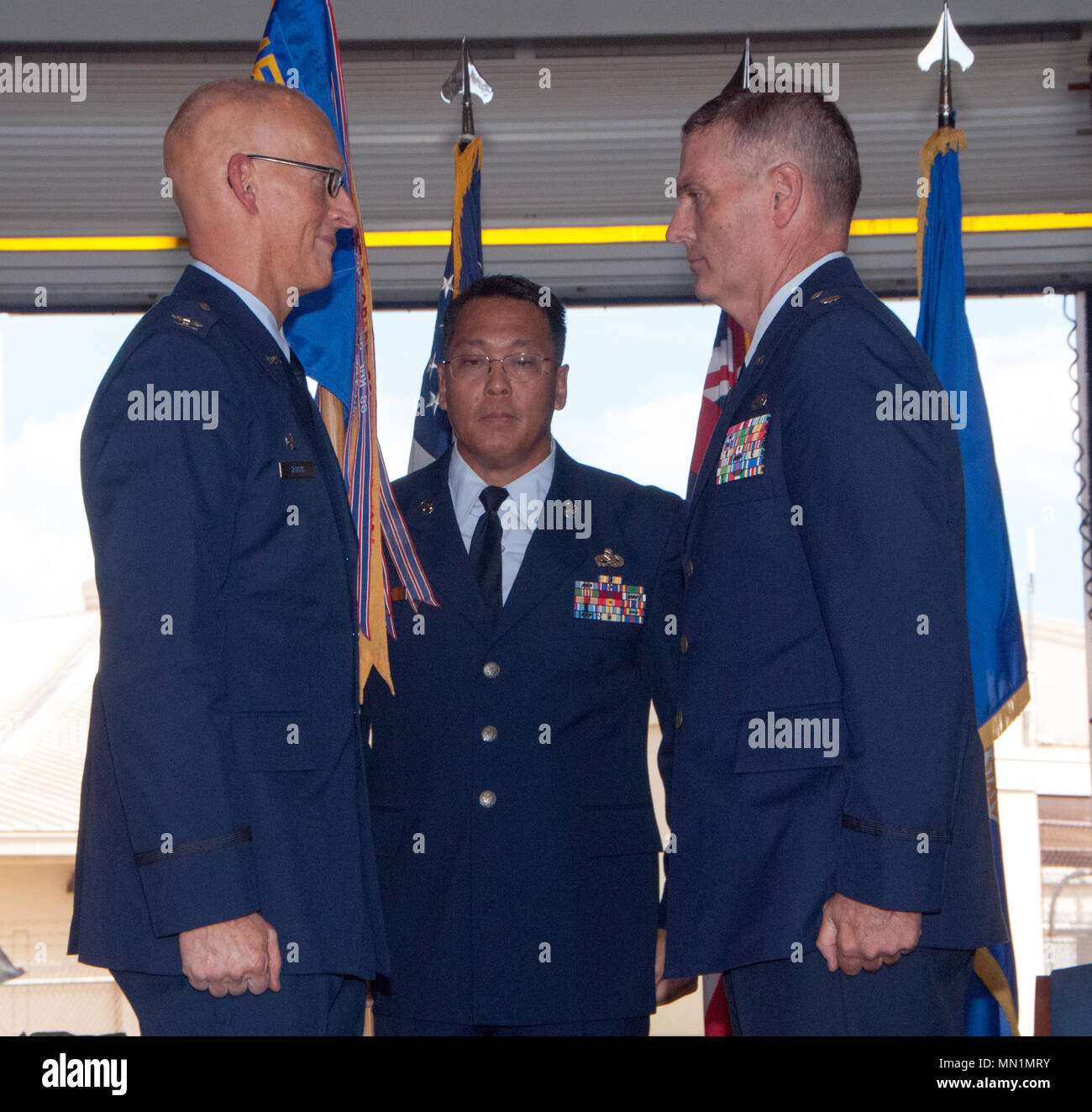 Col. Joseph Harris, commander, 154th Maintanence Group prepares to hand ...