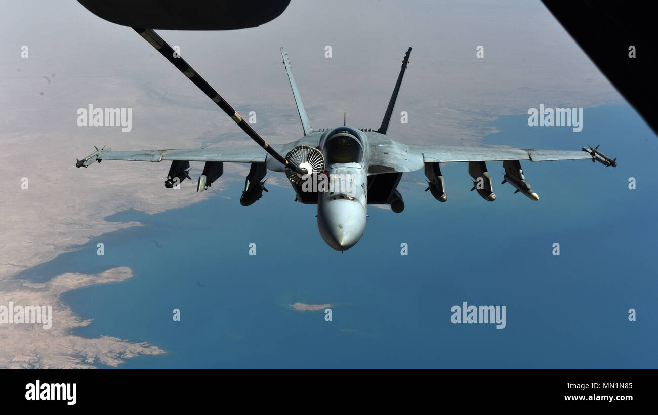 A U.S. Navy F/A-18 Super Hornet receives fuel from a 908th ...