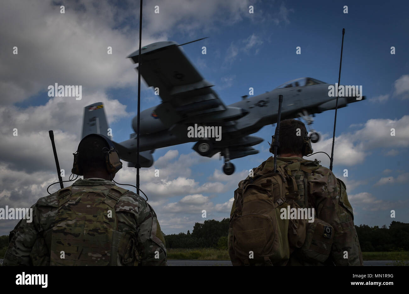 Two combat controllers with the 321st Special Tactics Squadron observe ...