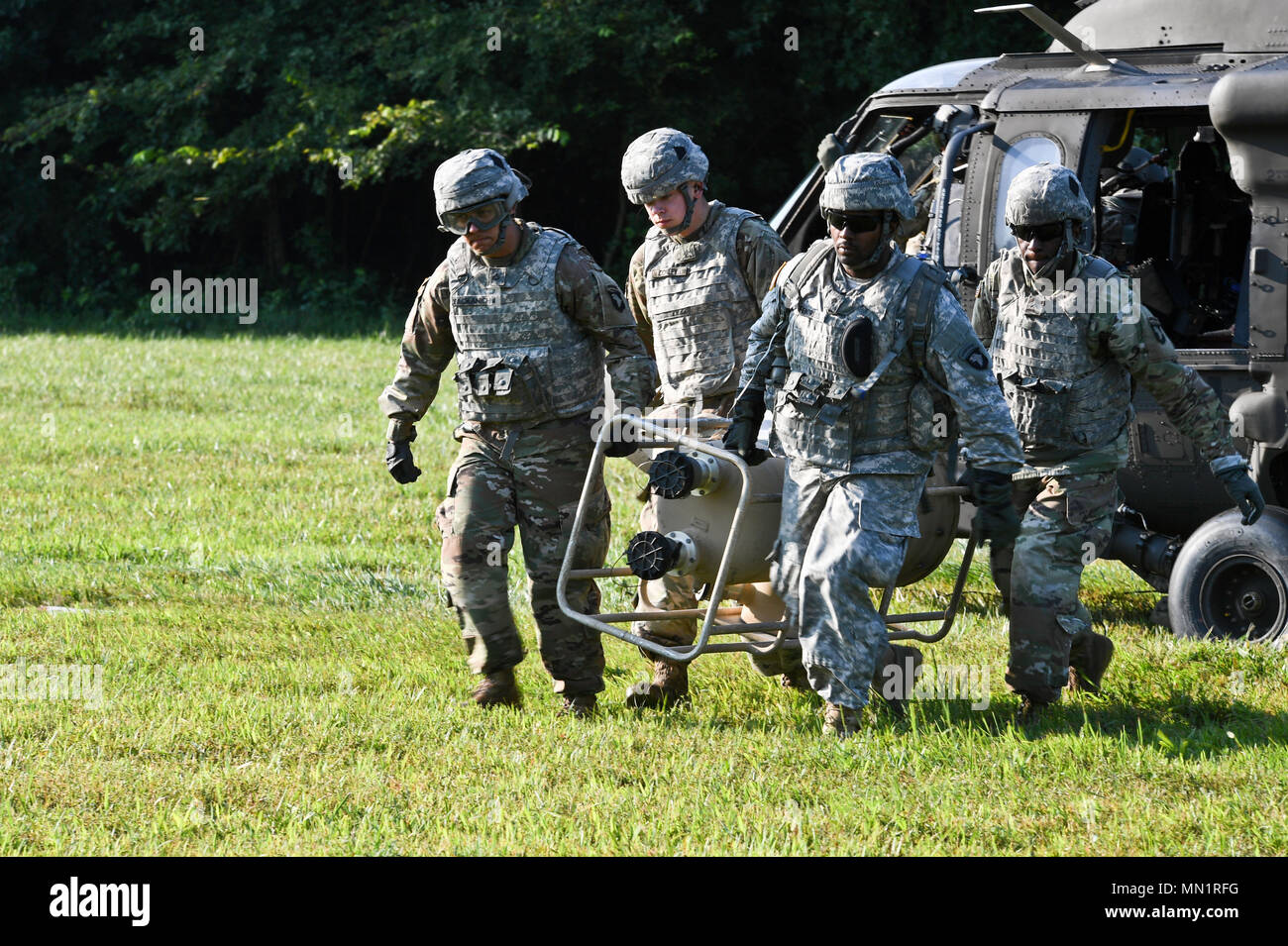 Soldiers assigned to 6-101 GSAB carry a piece of equipment for ...