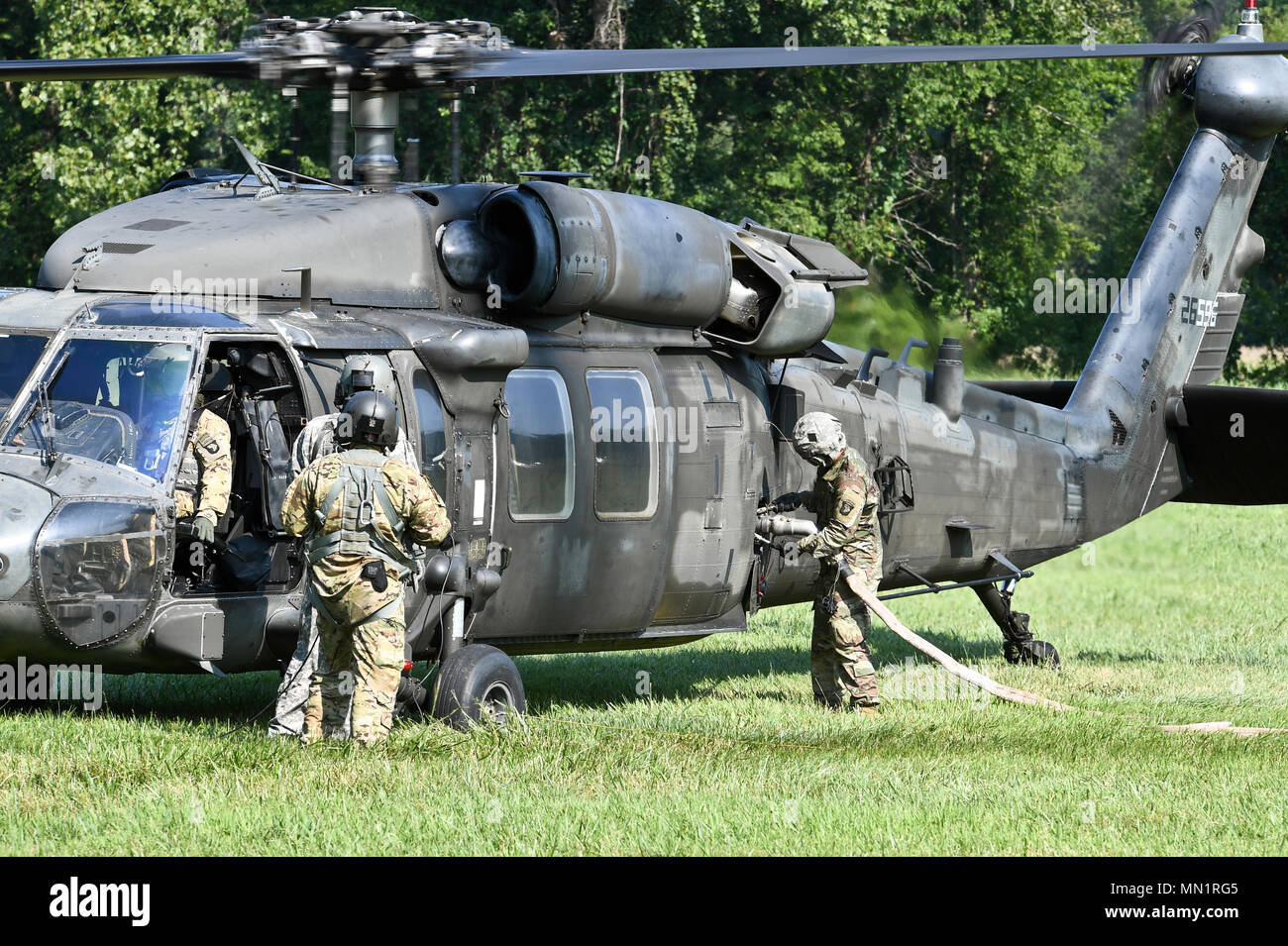 Soldiers assigned to 6-101 GSAB refuel a Blackhawk helicopter during ...
