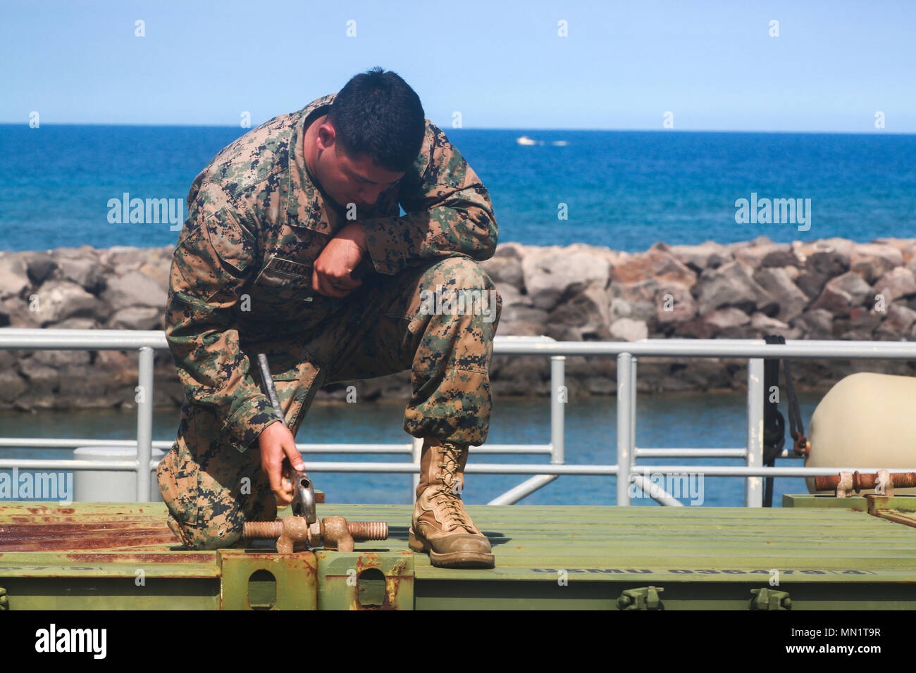 Lance Cpl. Victor Delacruz, a heavy equipment mechanic with Marine Wing ...