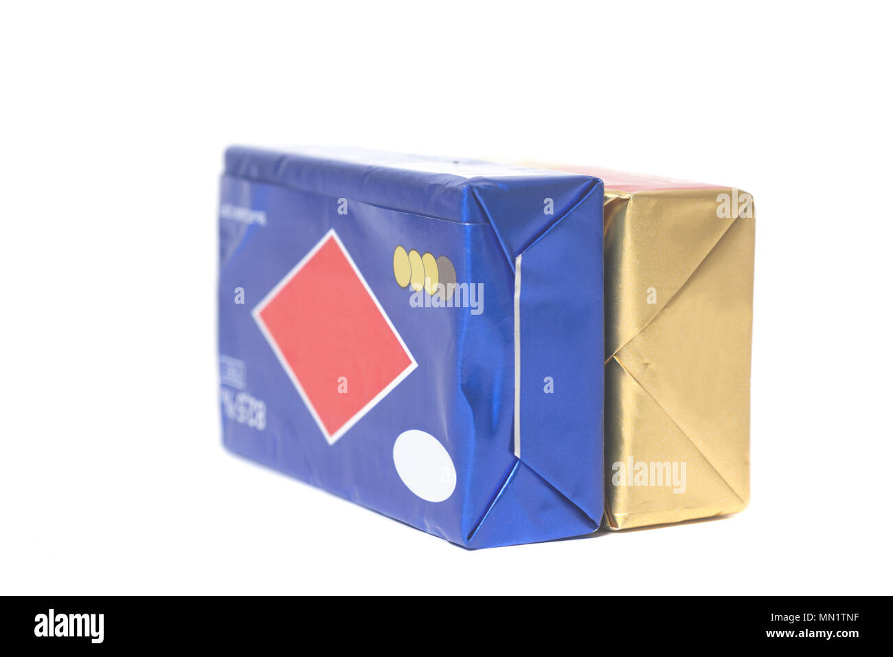 Sticks of wrapped butter isolated on white background Stock Photo - Alamy