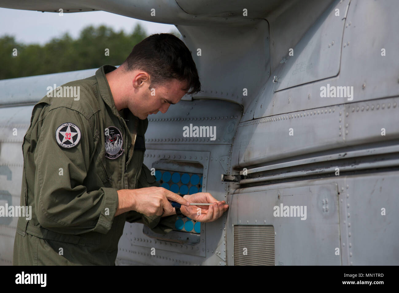U.S. Marine Corps Capt. John C. Lee, a UH-1Y Huey pilot attached to ...