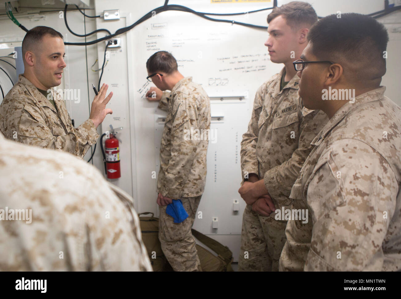 U.S. Marine Corps Chief Warrant Officer 3 Paul S. Mancuso, left, Combat ...
